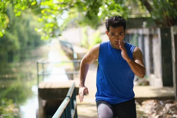 athletic sport man and sprinter having speed running practice and ...