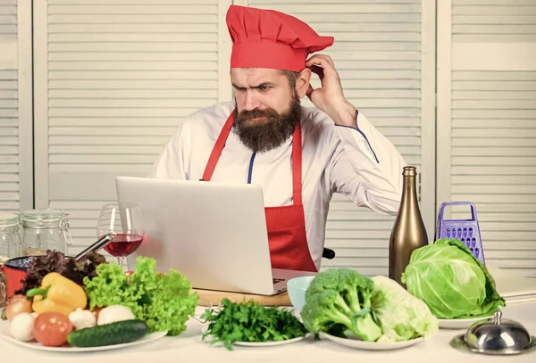 Elearning concept. Man chef searching internet recipe cooking food ...
