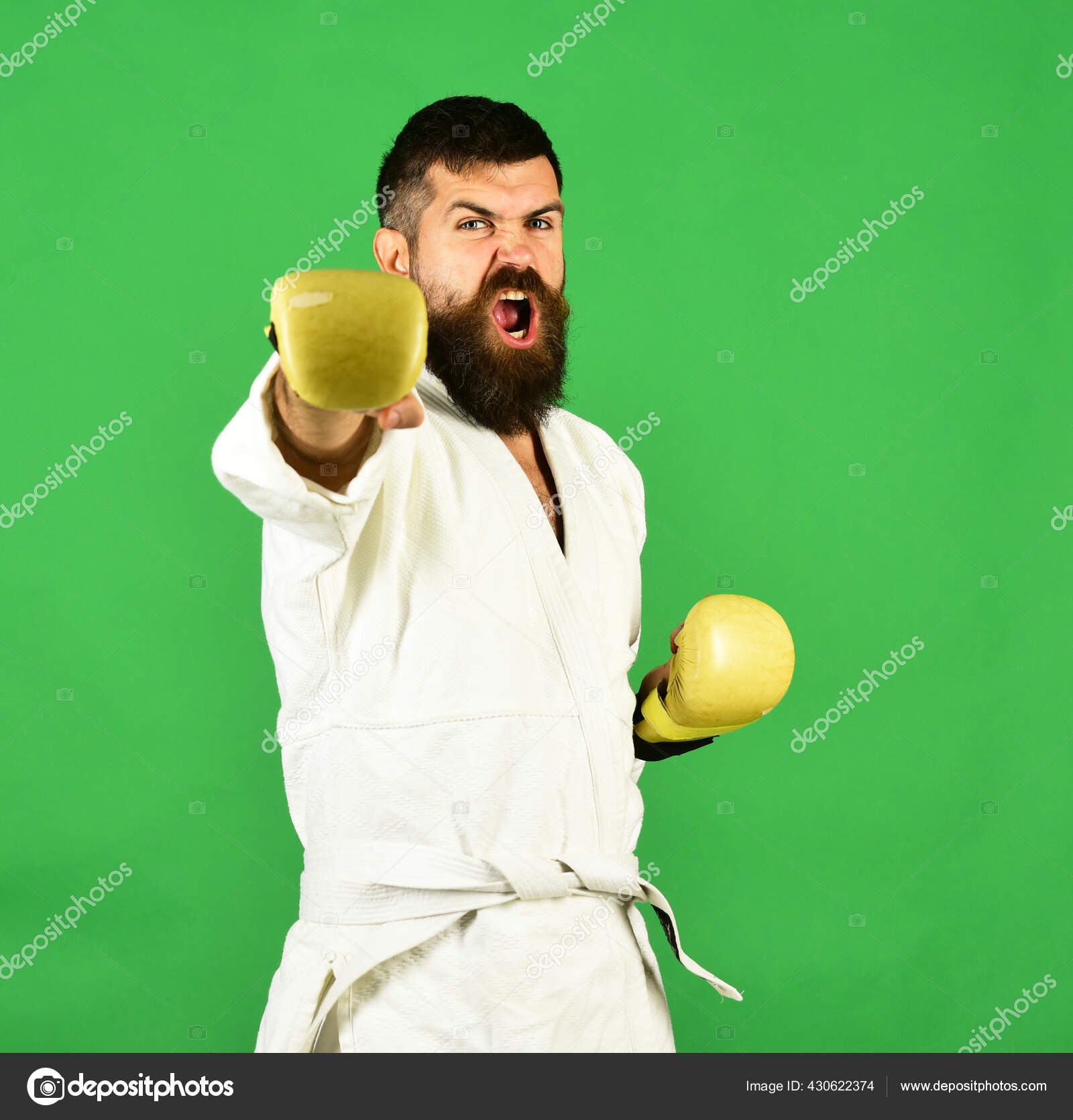 Healthy lifestyle and sports concept. Karate man with raging face ...