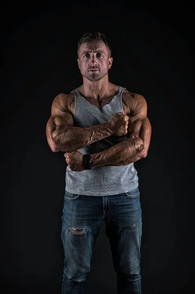 Unhappy bodybuilder wear casual undershirt with jeans showing strong ...