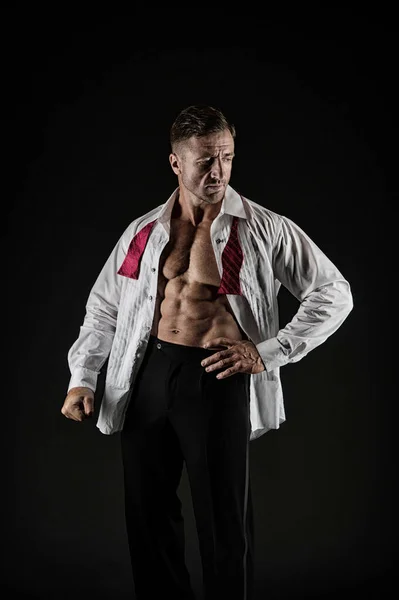 Strong and elegant. Muscular man black background. Formal style ...