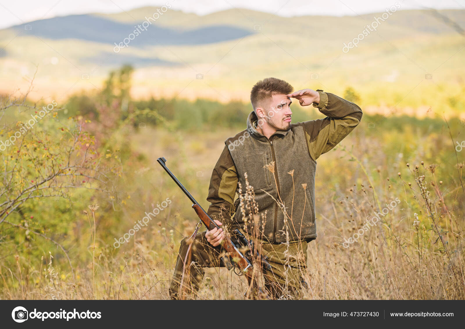 Hunter hold rifle. Focus and concentration of experienced hunter ...