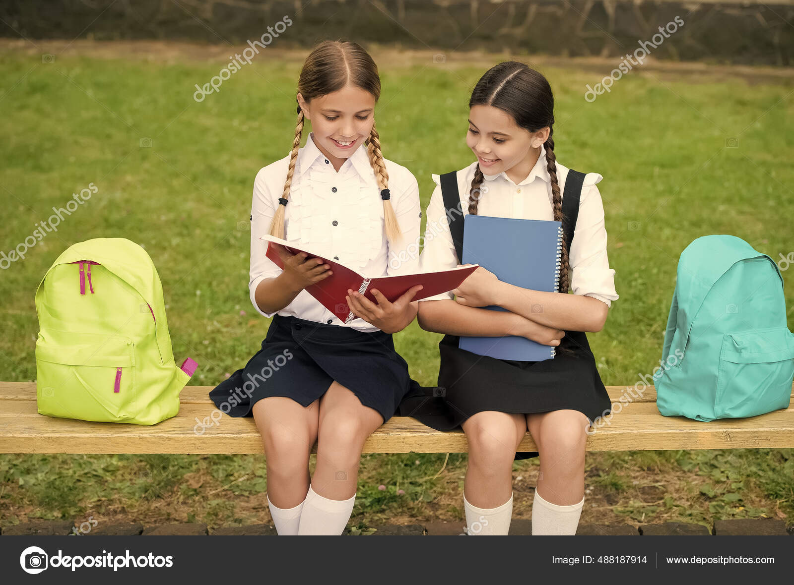 Help and support. children read notebook for making notes. happy ...