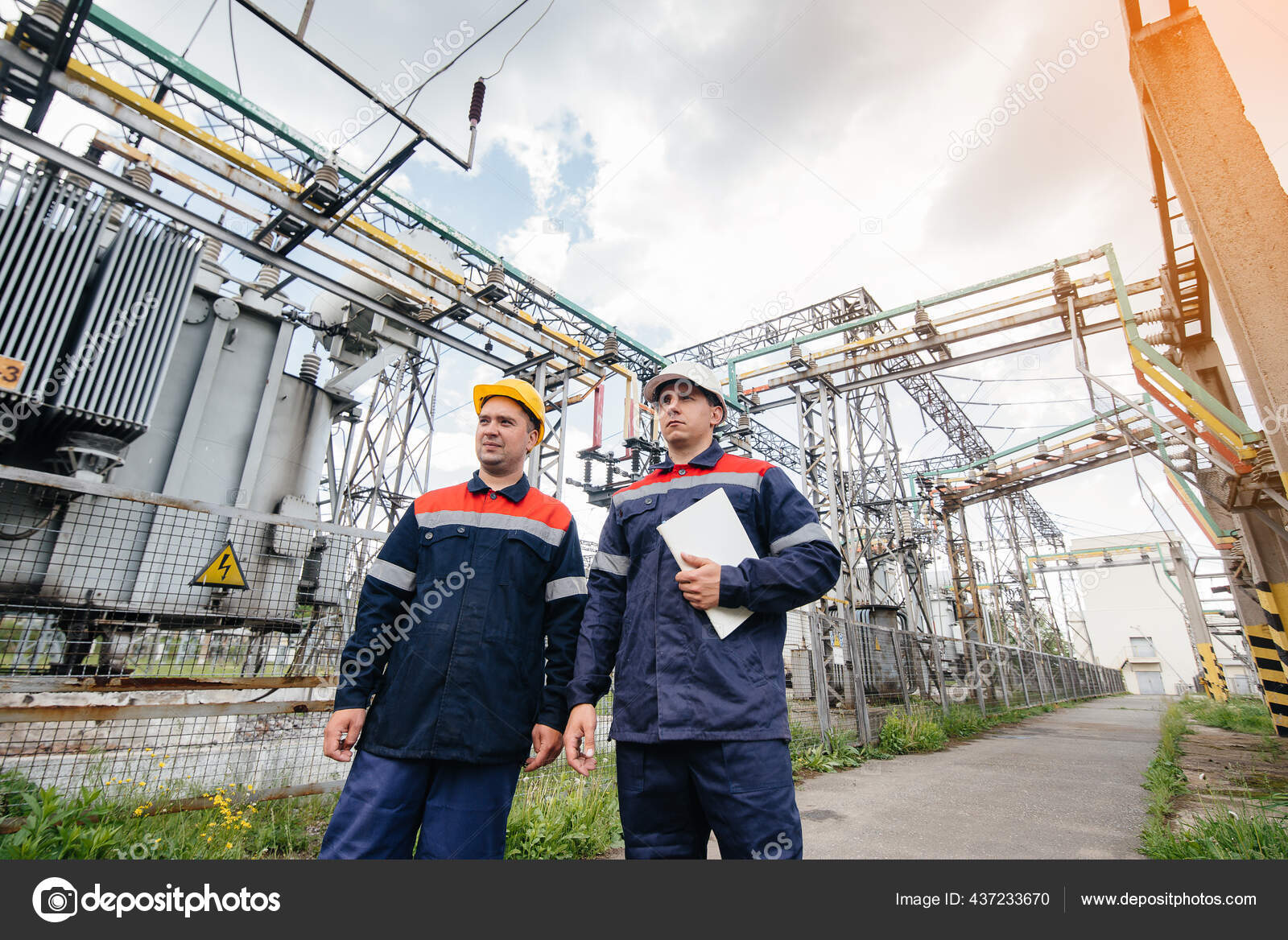 Two Specialist Electrical Substation Engineers Inspect Modern High ...