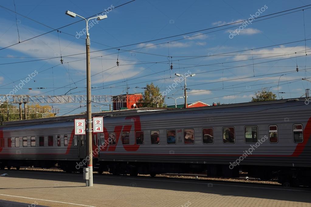 The composition of the passenger train with the acronym on the wagon ...