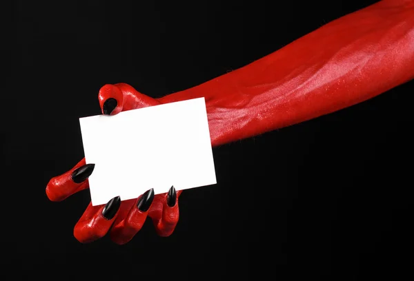Halloween theme: Red devil hand with black nails holding a blank white ...