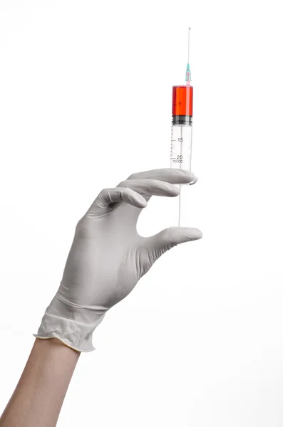 Hand holding a syringe Stock Photo by ©Ambrophoto 5300545