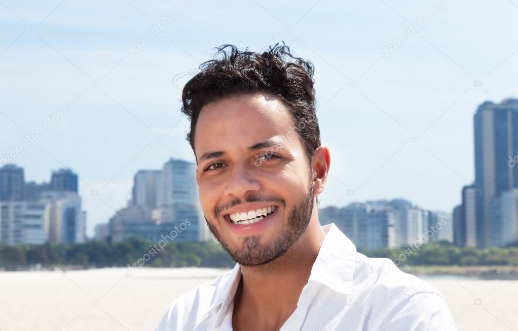 Modern brazilian man with skyline in the background Stock Photo by ...