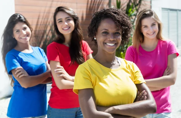 Four international girls with crossed arms - Stock Image - Everypixel