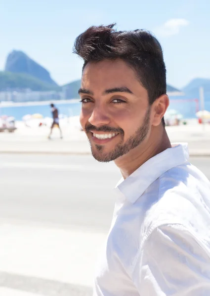 Dreaming brazilian guy in a modern city — Stock Photo © kadettmann ...