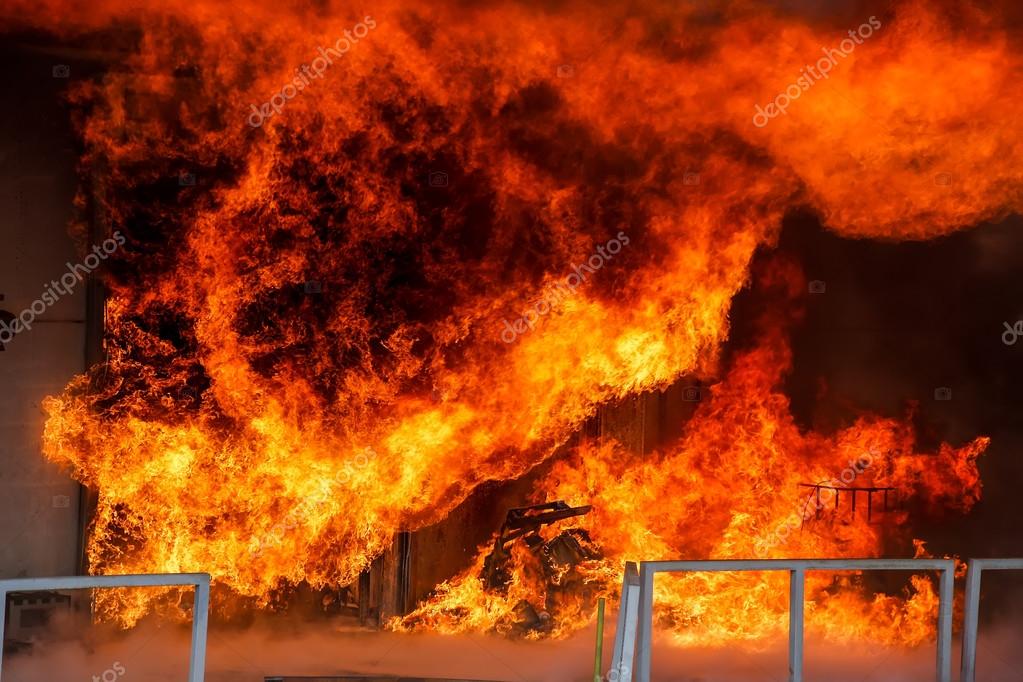 Firefighters struggle to extinguish the fire that broke out at a ...