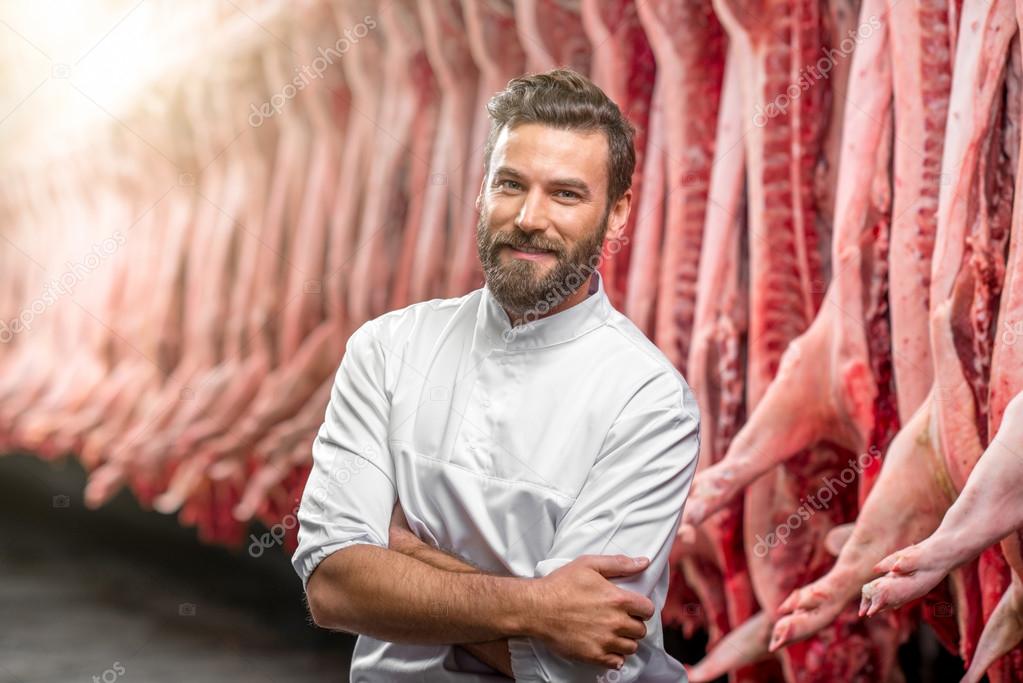 Portrait of a handsome butcher at the manufacturing Stock Photo by ...