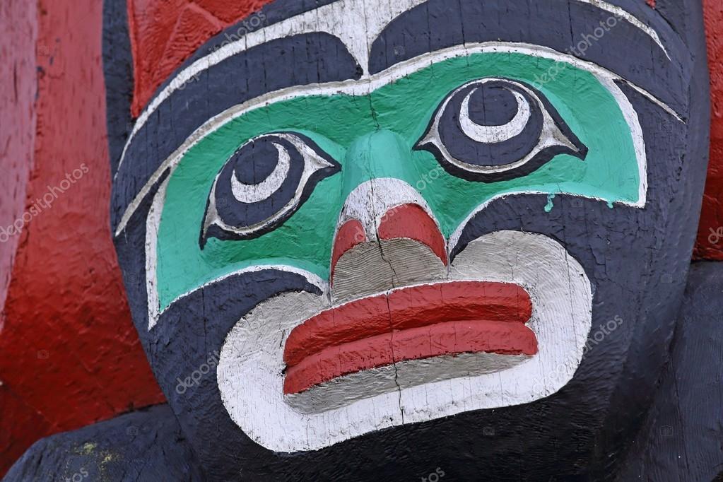 Totem poles faces | Ritual painted face as fragment of totem pole ...
