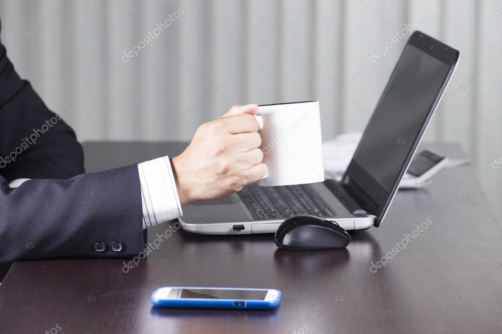 Businessman holding cup of coffee — Stock Photo © kung_mangkorn #56353767 Businessman holding cup of coffee — Stock Photo © kung_mangkorn #56353767