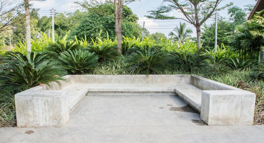 Modern concrete bench in garden Stock Photo by ©yaryhee 62224119