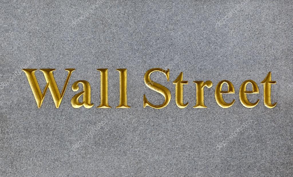 Street name carved in the concrete wall of the building in golde Stock ...