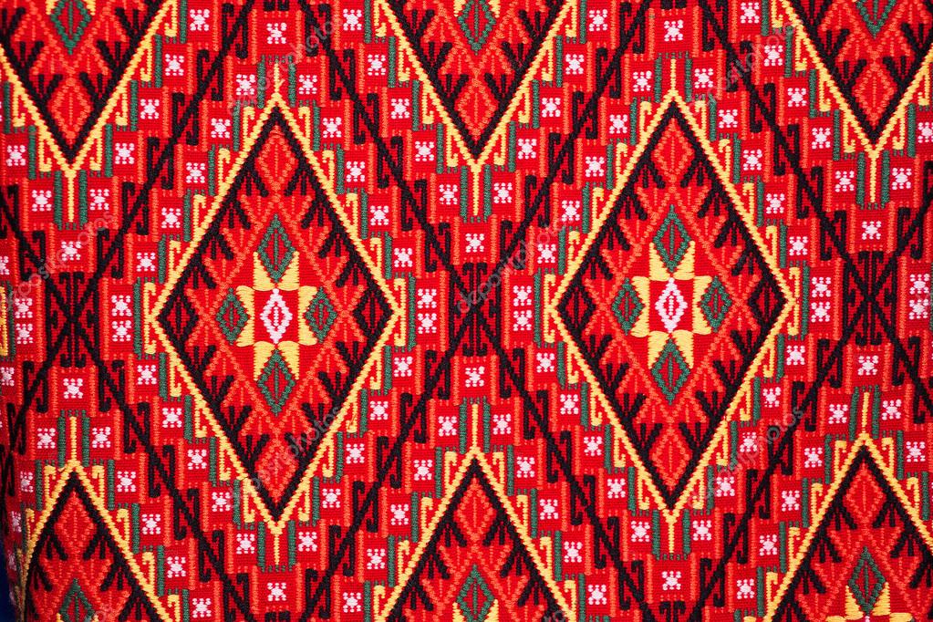 Colorful thai handcraft peruvian style rug surface close up. More of ...