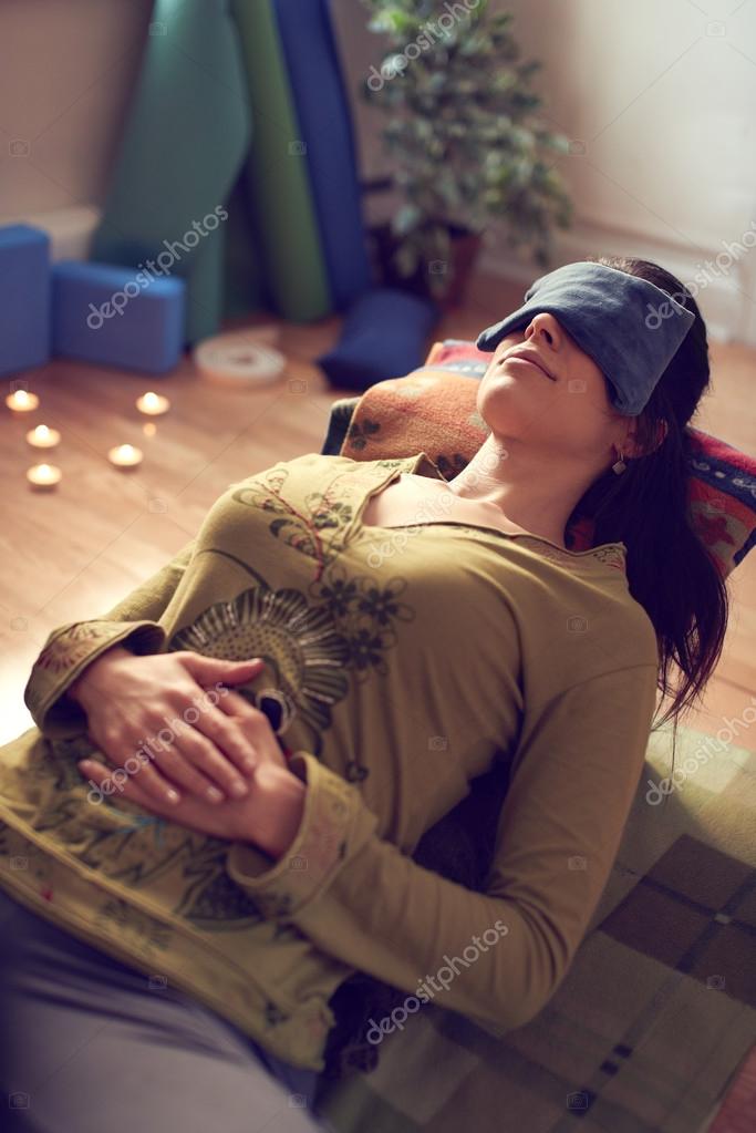Attractive mixed race woman doing restorative yoga — Stock Photo ... Attractive mixed race woman doing restorative yoga — Stock Photo ...