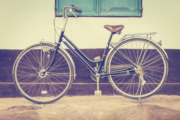 Very old bicycle on wall — Stock Photo © johnnychaos #1793947