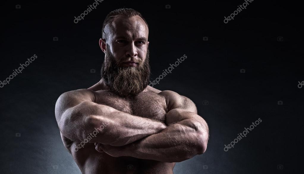 Strong bearded man with perfect abs, shoulders, biceps, triceps Stock ...