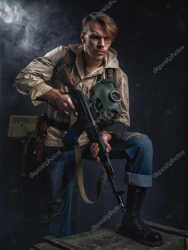 Armed man with a gun. Stalker. — Stock Photo © fotoatelie #95368676