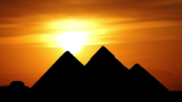 Sun goes behind great pyramids in Giza valley during gorgeous sunset ...