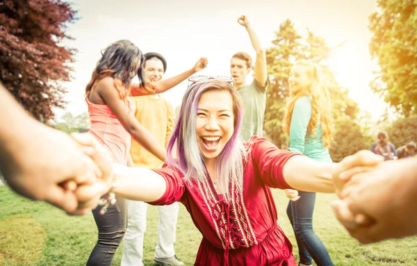 Group of students making party in the park, follow me stance - Stock ...