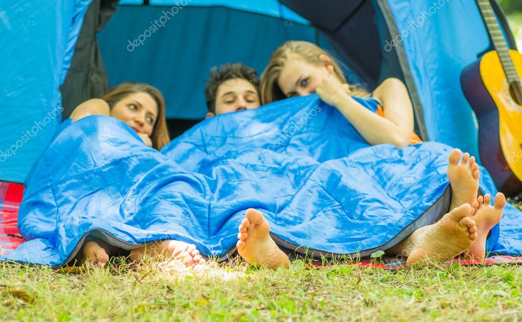 Friends having fun on camping — Stock Photo © oneinchpunch #55116219