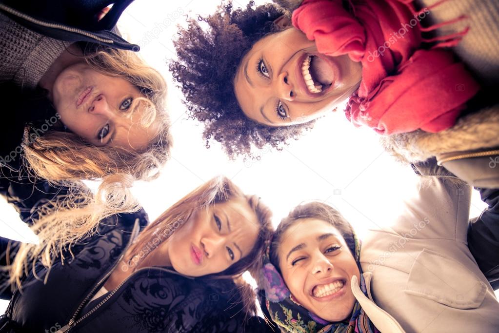 Four young beautiful girls smiling — Stock Photo © oneinchpunch #62731179 Four young beautiful girls smiling — Stock Photo © oneinchpunch #62731179