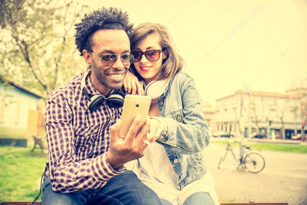 Happy coouple with mobile phone — Stock Photo © oneinchpunch #71541155