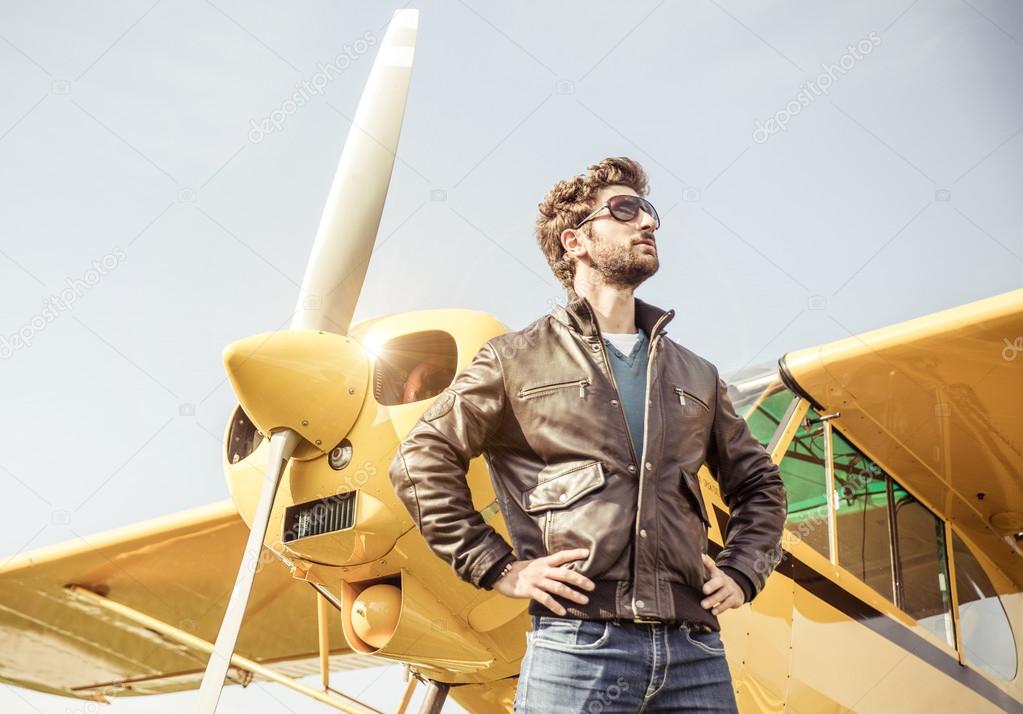 Aviator posing before flight Stock Photo by ©oneinchpunch 74227475