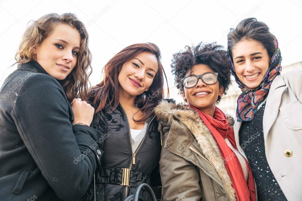 Four young beautiful girls smiling Stock Photo by ©oneinchpunch 84879576 Four young beautiful girls smiling Stock Photo by ©oneinchpunch 84879576