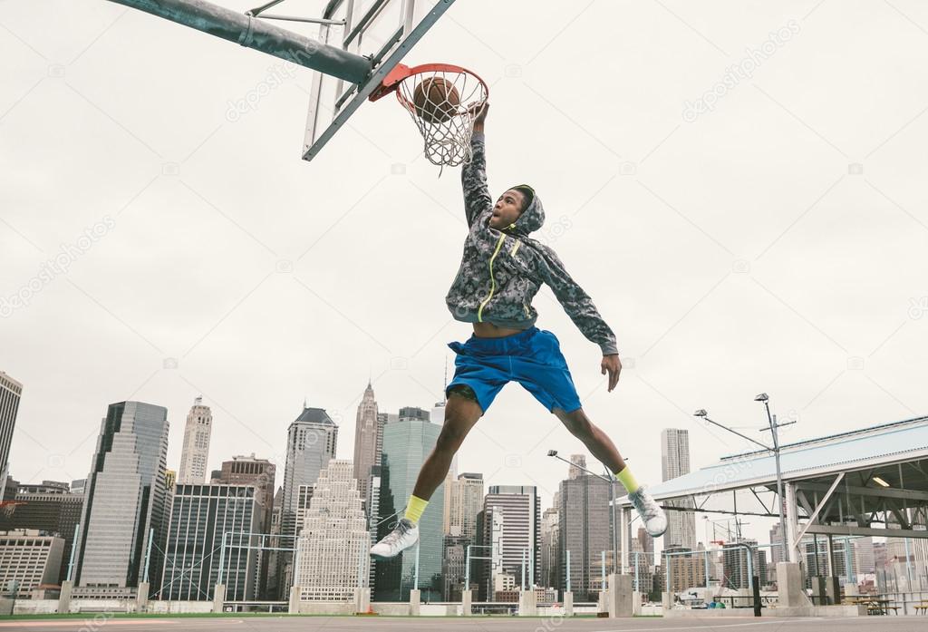 Basketball player performing slum dunk — Stock Photo © oneinchpunch ...