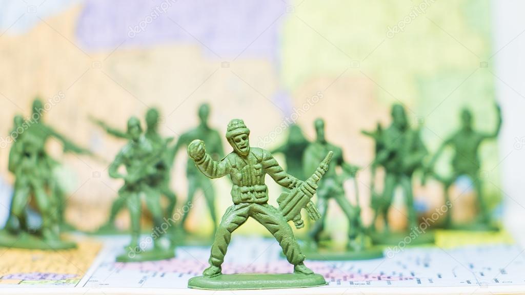 Toy Soldiers on paper map background Stock Photo by ©sirichaiDeposit ...