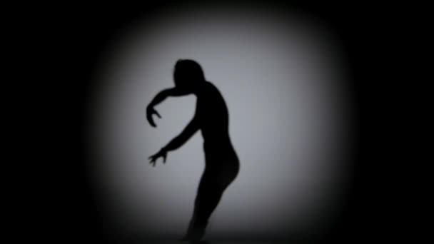 Falling contemp moves in shadow of girl dancer on black background ...