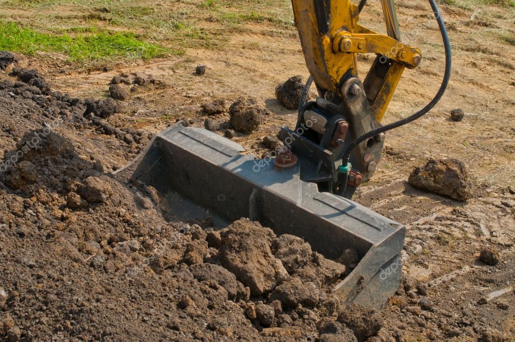Earthwork with heavy machinery Stock Photo by ©minco.soska 114469424