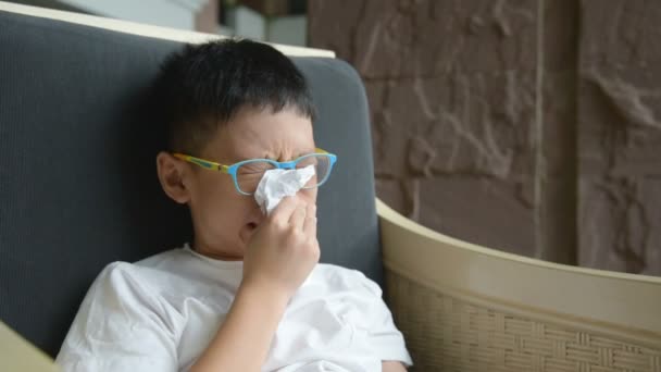 Boy wipes his snot by tissue paper Stock Video Footage by ...
