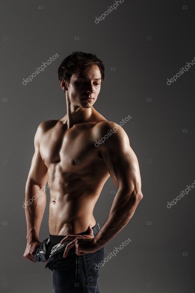Muscular male model bodybuilder before training. Studio shot on — Stock ...