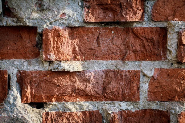 The brick in the wall is crumbling from time, close-up - Stock Image ...
