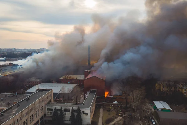 Massive large blaze fire in the city, aerial drone top view brick ...