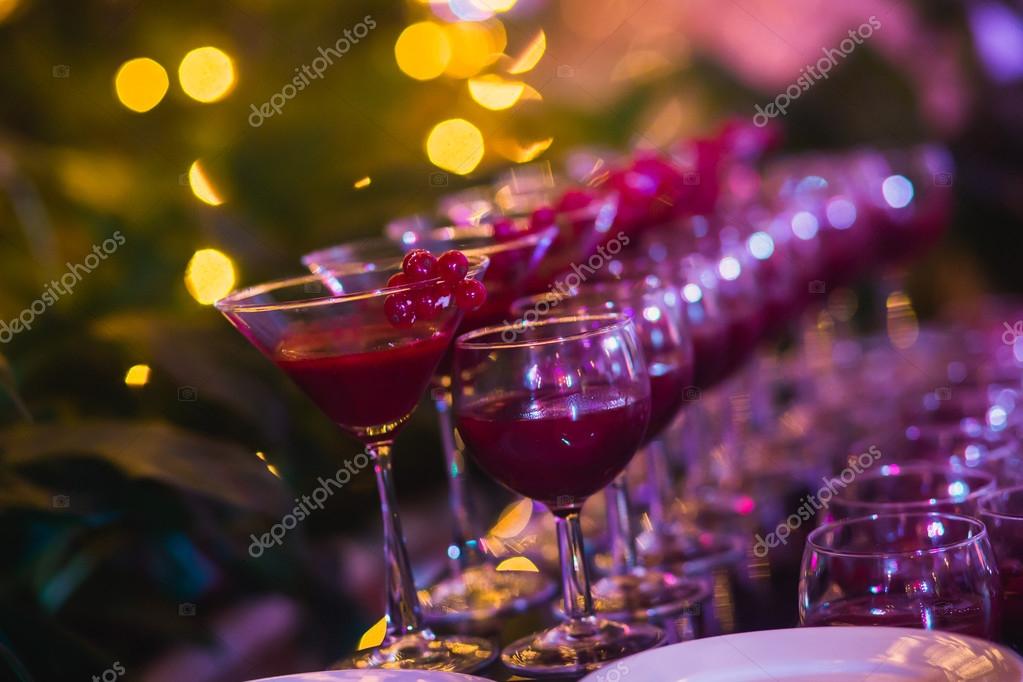 Beautiful line of different colored cocktails with smoke on a Christmas ...