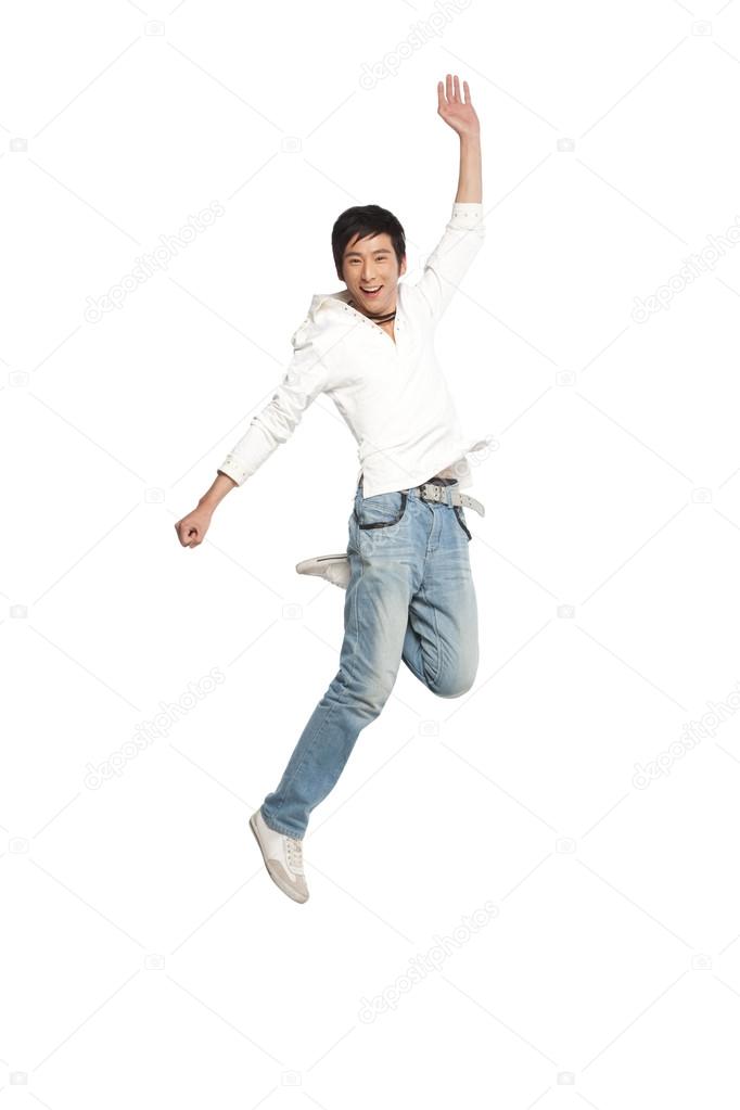 Portrait of a young man mid-air — Stock Photo © XiXinXing #80701492