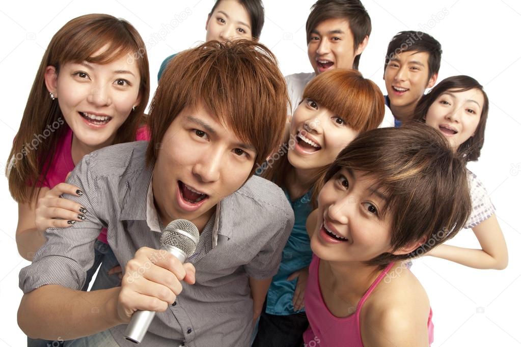 A group of young people singing — Stock Photo © XiXinXing #90407834