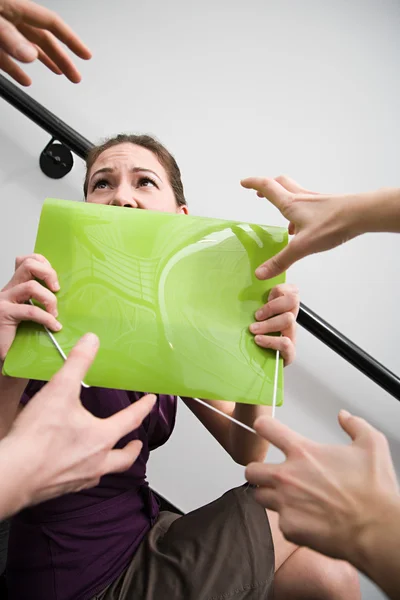 People trying to grab file from woman - Stock Image - Everypixel