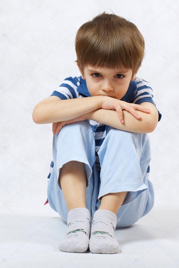 A sad boy of six years old. Stock Photo by ©Tolikoff 106622440