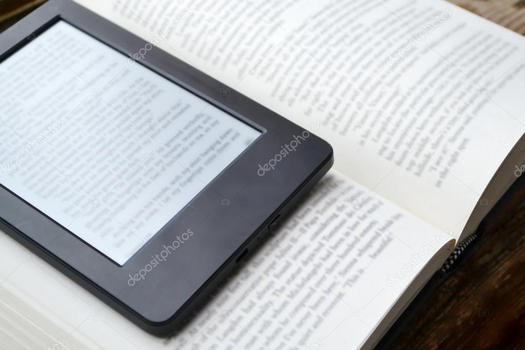 Book reader and an old fashioned book — Stock Photo © mariakarabella ...