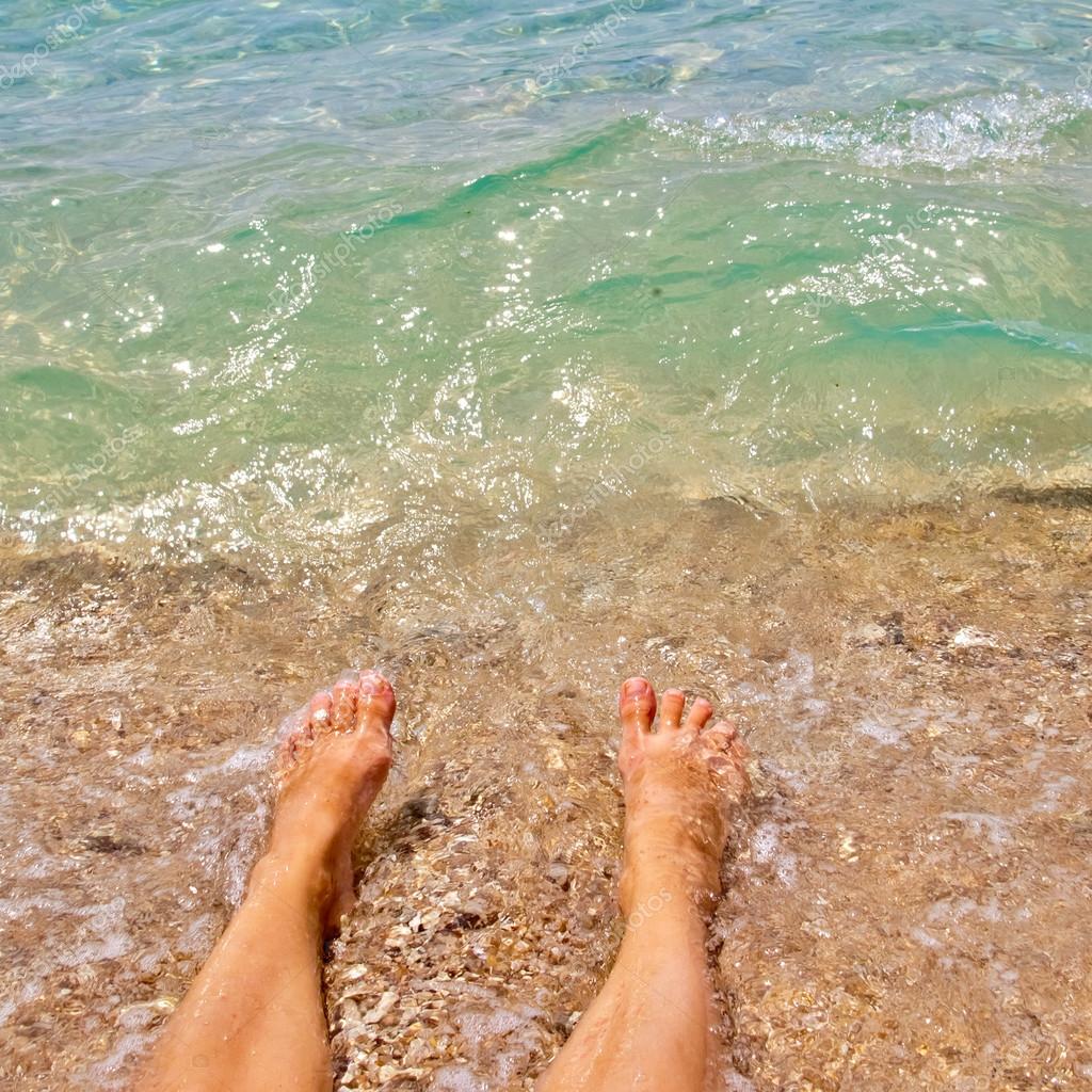 Legs on the sea background — Stock Photo © watman #67614637