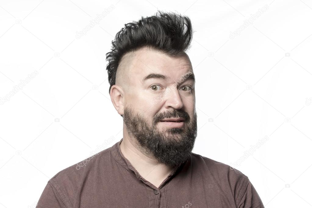 Man with mohawk hairstyle and beard Stock Photo by ©watman 89731734