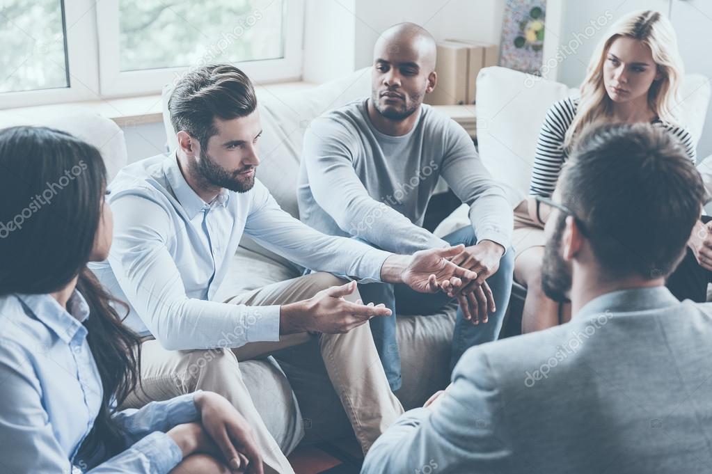 People sitting around the desk Stock Photo by ©gstockstudio 114079614