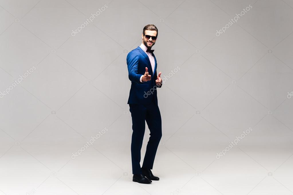 Handsome man in full suit Stock Photo by ©gstockstudio 120098152